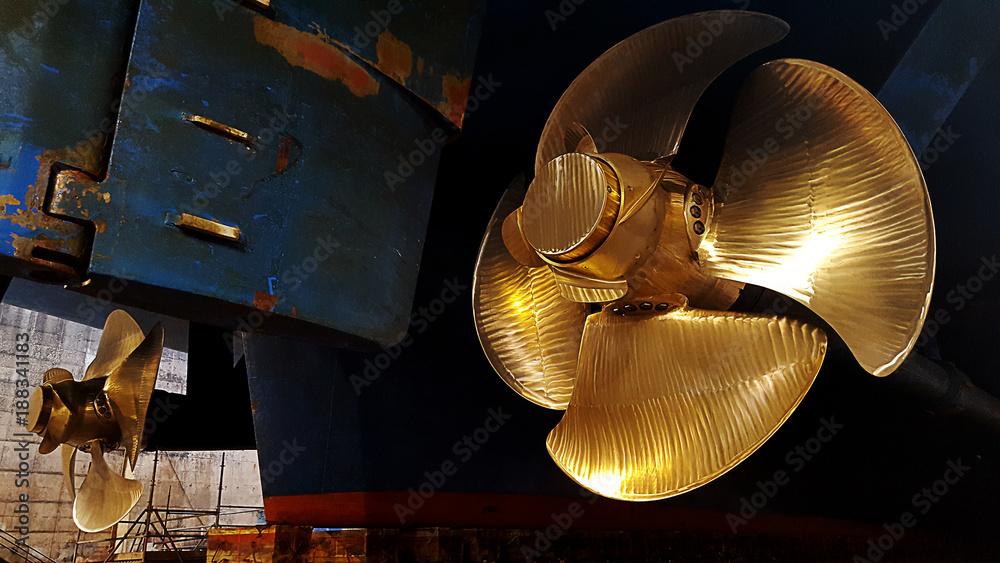 black ship hull and golden propeller at drydock Stock Photo | Adobe Stock