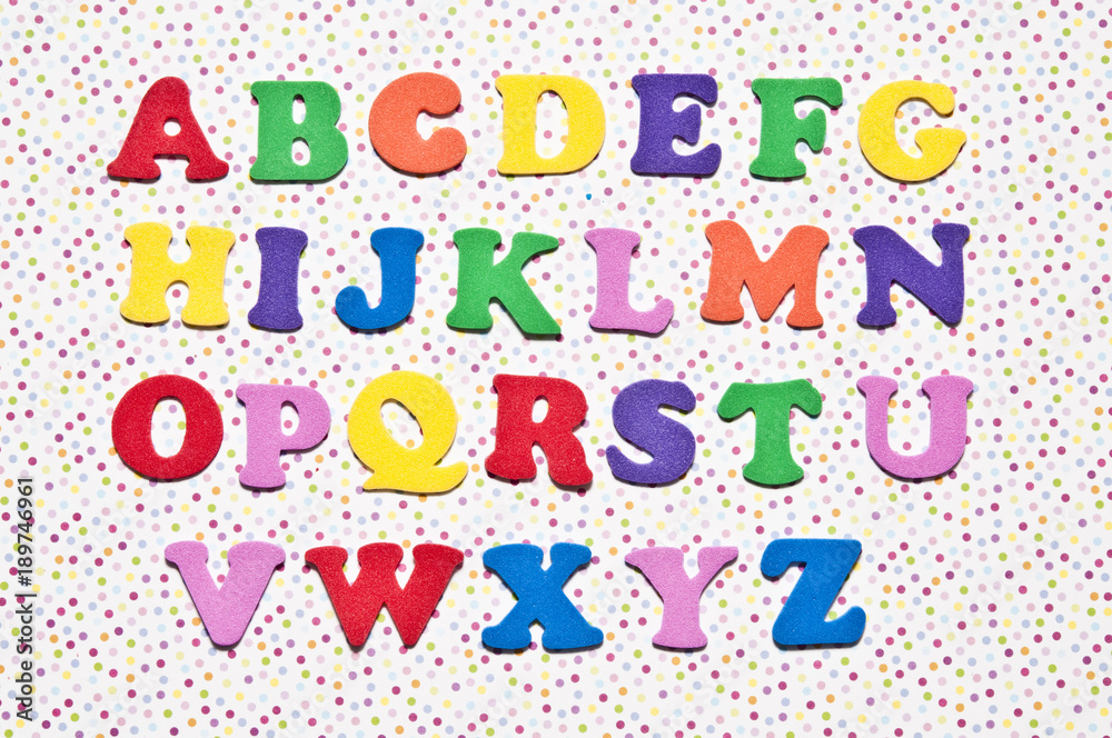 colorful alphabet letters, a to z over jolly background with pola dots ...