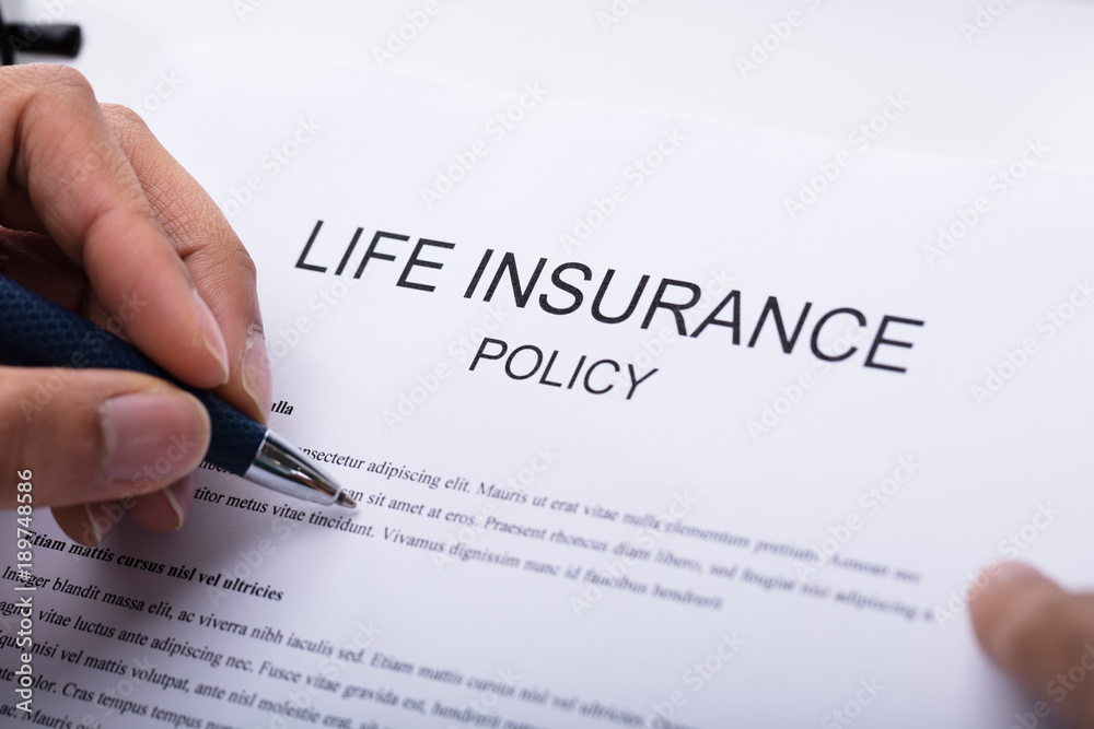 Person Filling Life Insurance Policy Form Stock Photo | Adobe Stock