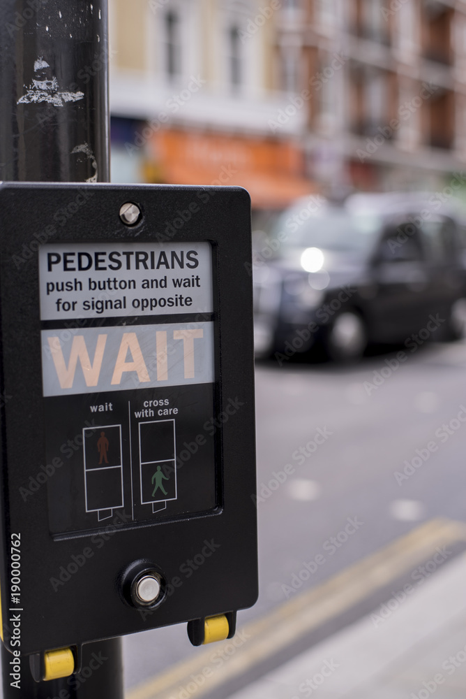 Crosswalk button for pedestrian, London UK - Wait sign at a traffic ...