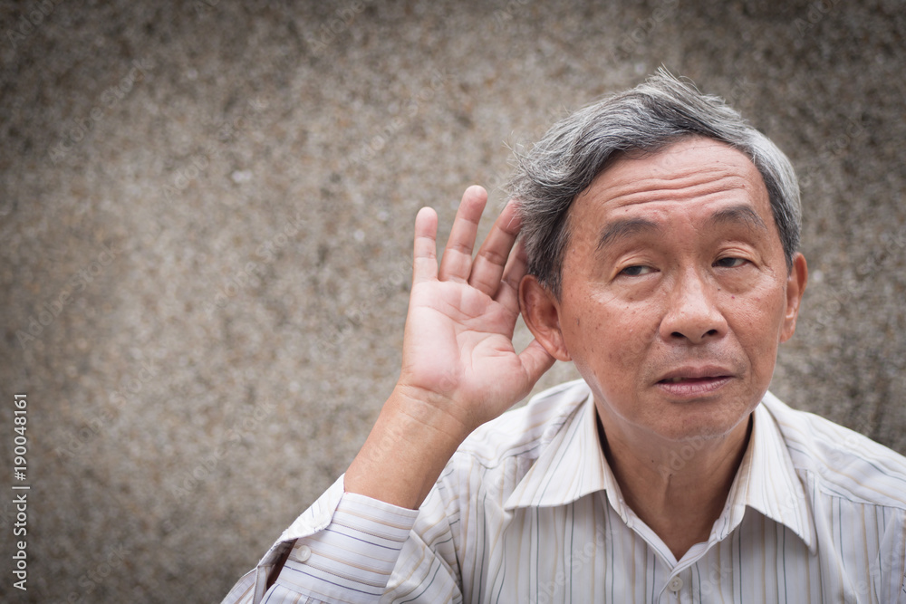 sad senior listening, old man hearing concept of deafness or hard of ...