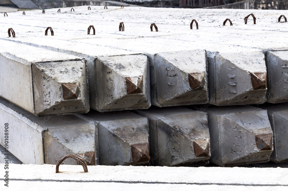 Стоковое фото «Stack of prestressed concrete piles on ground for ...