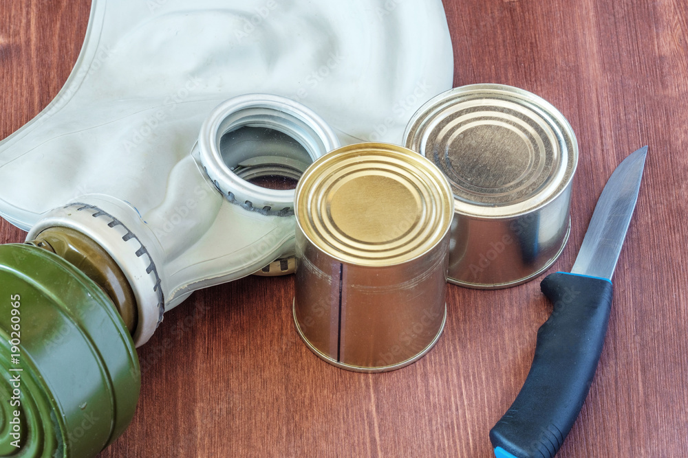 canned food and a knife with a gas mask in case of gas attacks ...