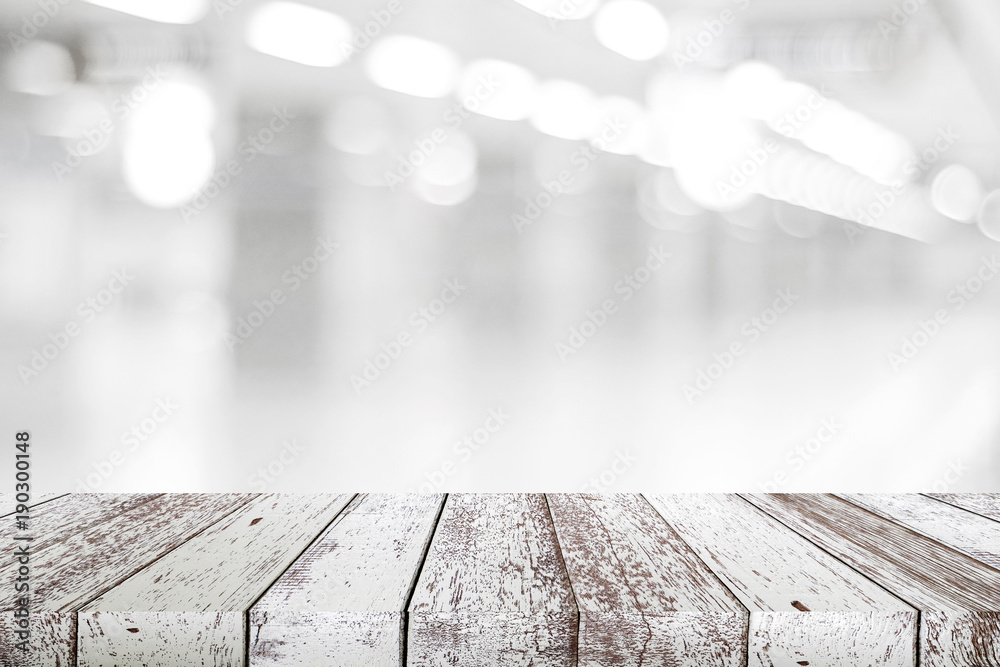 Empty vintage white wood table over blur store background, perspective ...