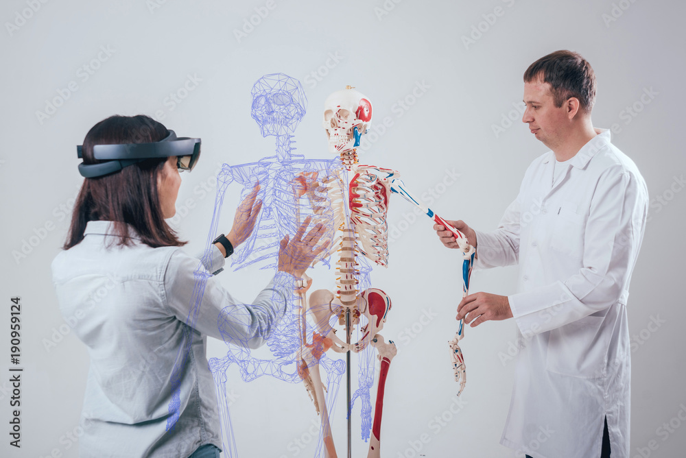 Doctor uses augmented reality goggles and human skeleton for teaching ...