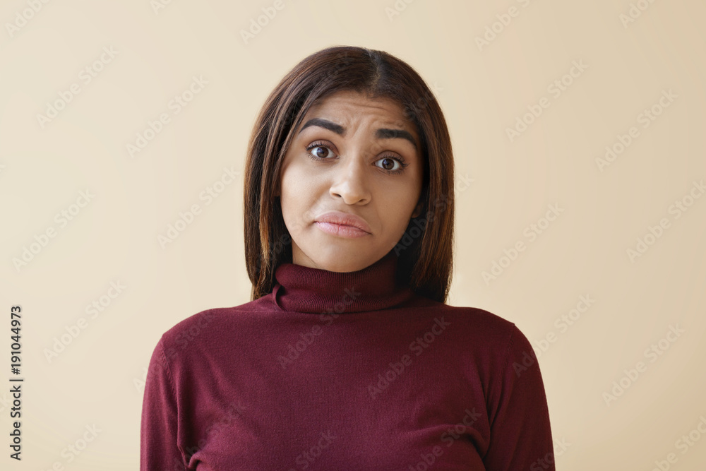 Foto I don't know. Picture of confused young mixed race female raising ...