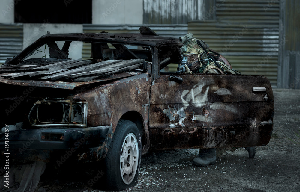 Soldier of the elite special purpose unit surveillance holding machine ...