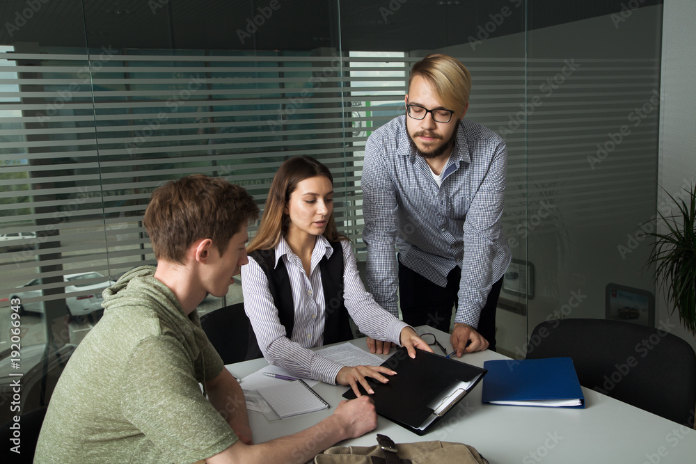 3 people work in the office Stock Photo | Adobe Stock