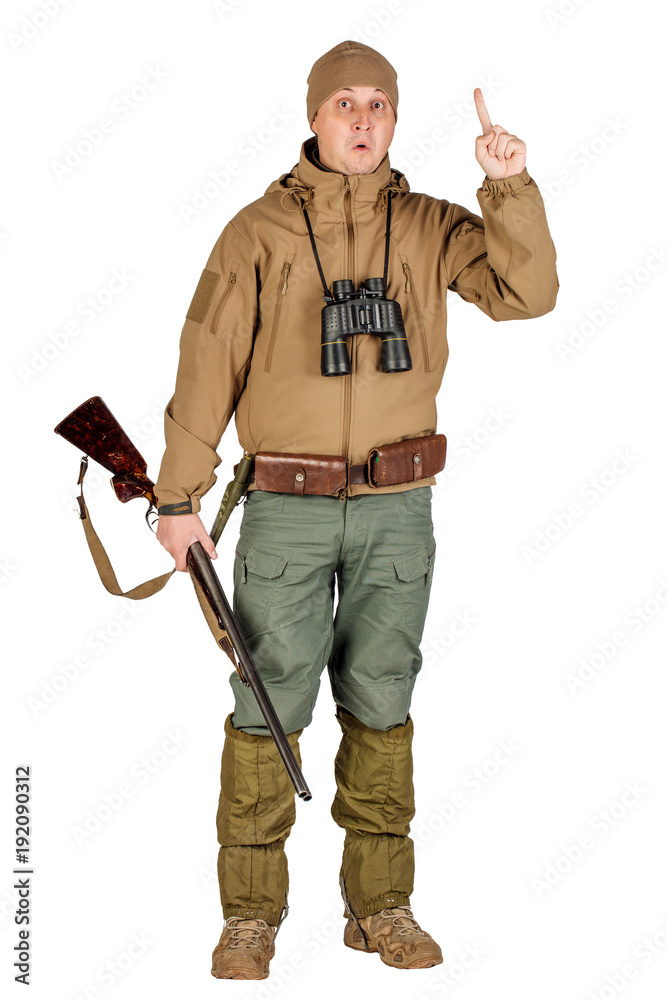 Full length portrait of a male hunter with double barreled shotgun ...