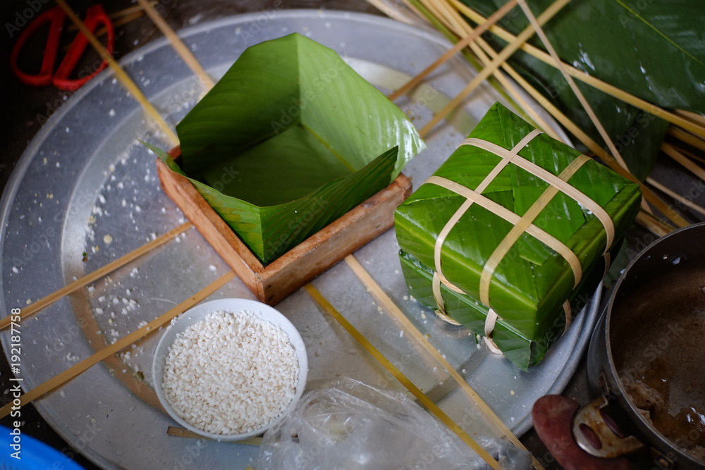 Packing Banh Chung (sticky rice cake), this is a traditional Vietnamese ...