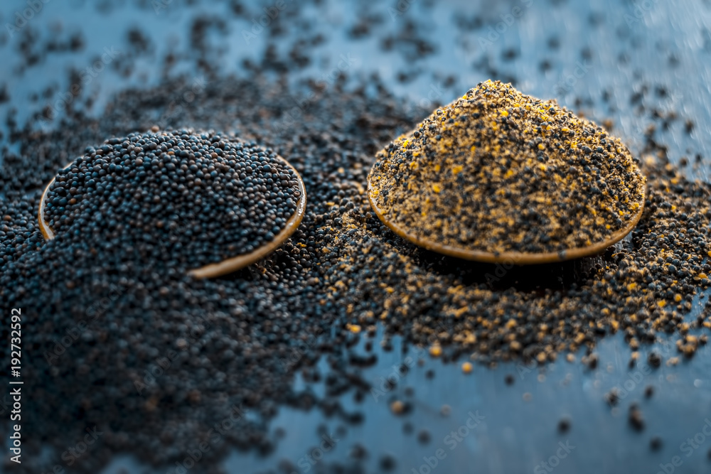 Raw Mustard seeds,Sarso,or rai on a wooden surface with dark Gothic ...