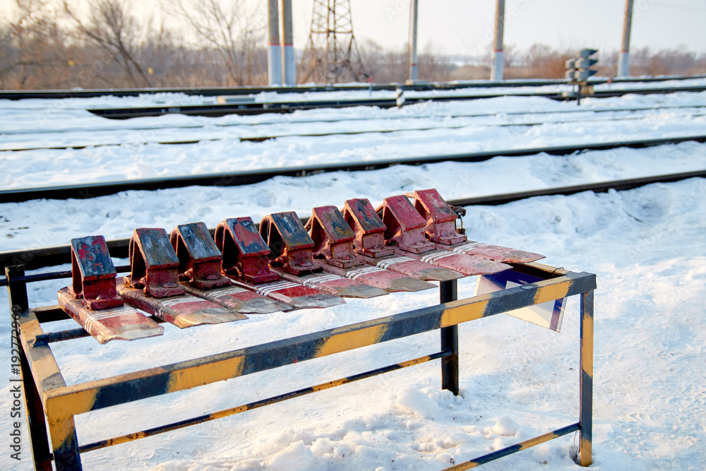 railway brake shoes of red color lie on the rack. railway skid. railway ...