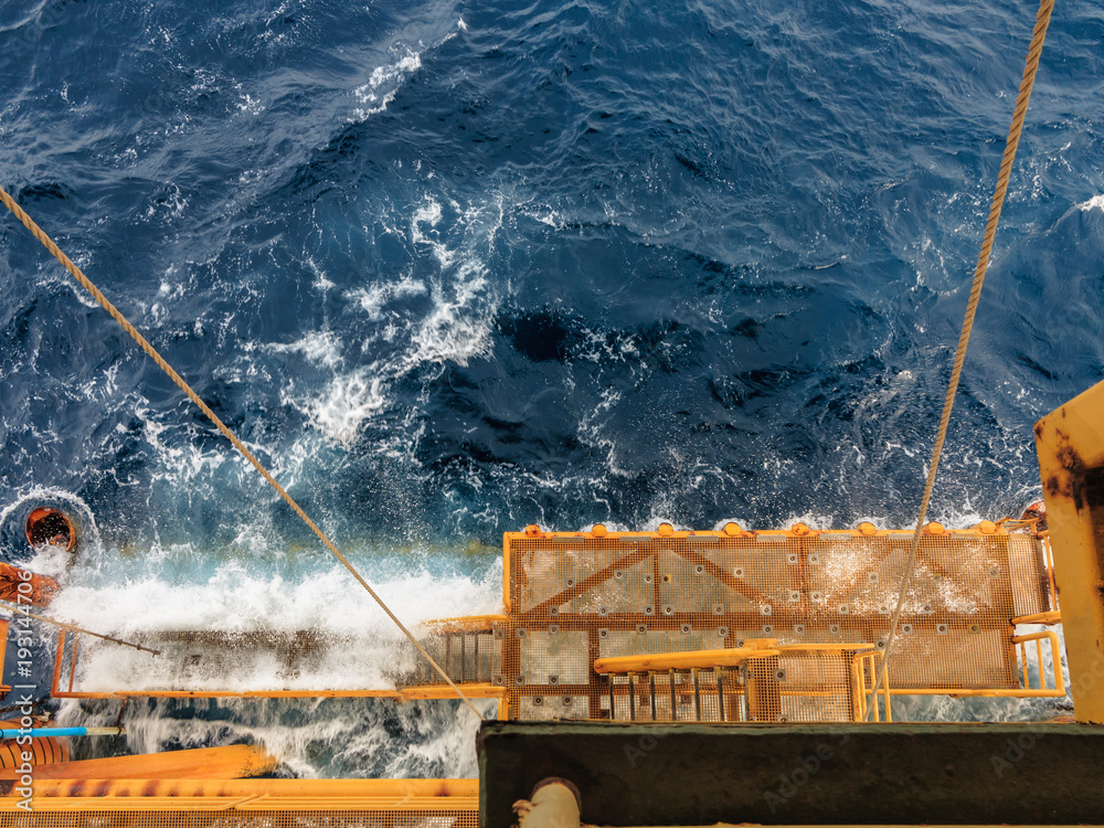 Offshore oil and gas platform at boat landing while the high wave in ...