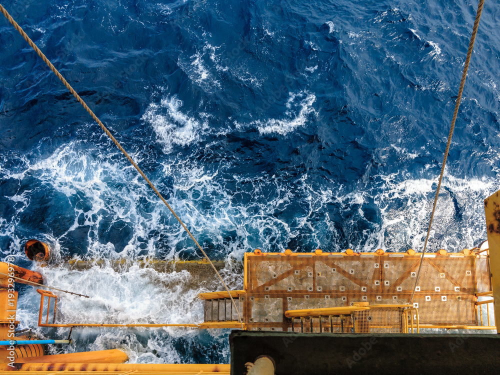 Offshore oil and gas platform at boat landing while the high wave in ...