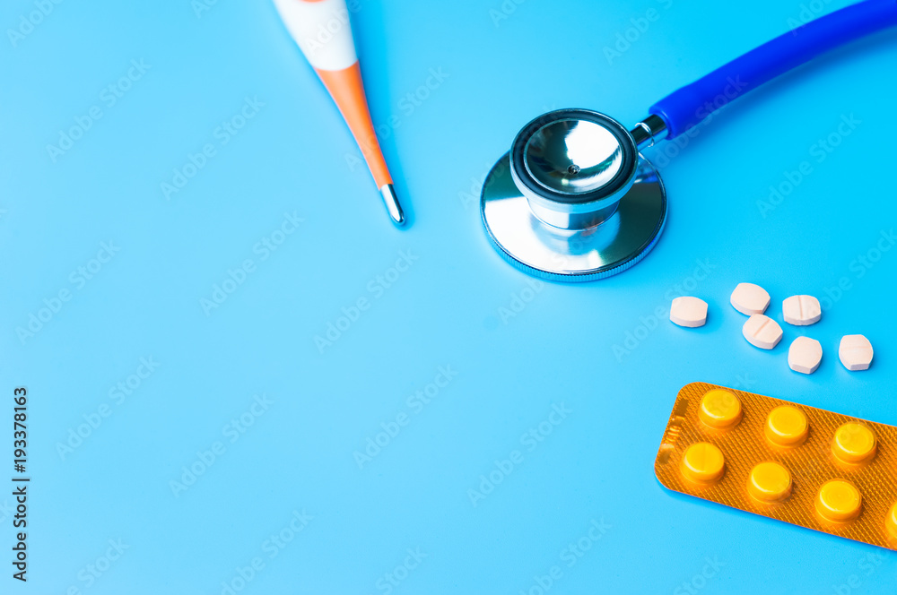 .Doctor office desk with medical blister of capsule pills red injection ...