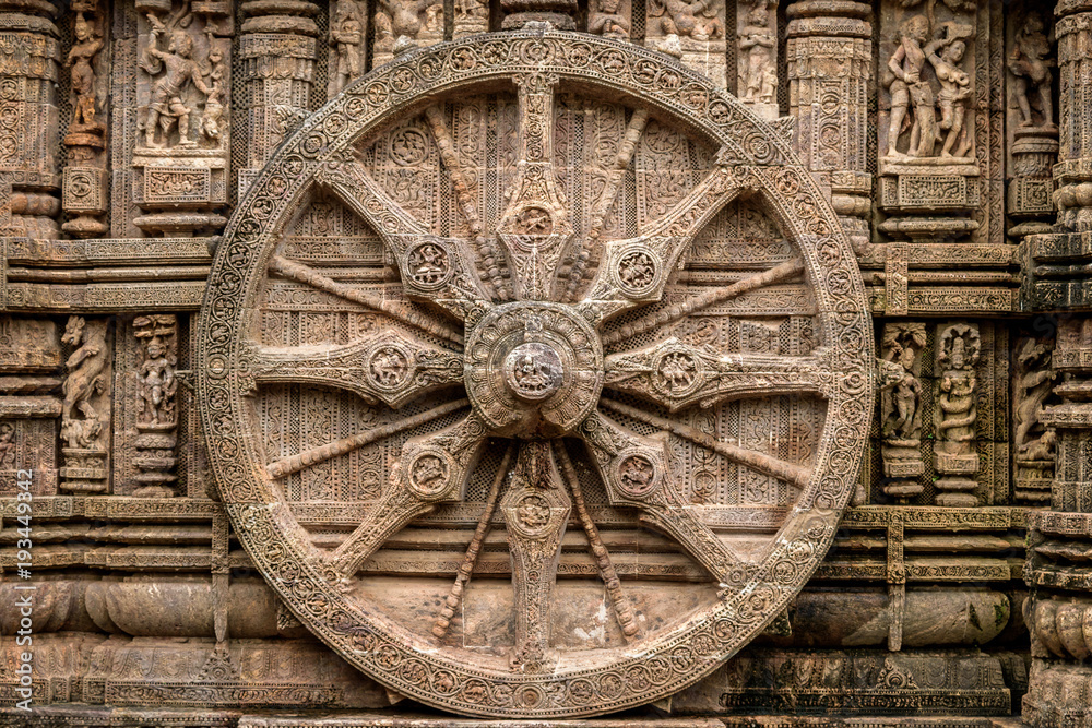 Intricate carvings on a stone wheel in the ancient Hindu Sun Temple at ...