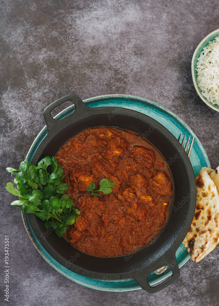 Indian lamb Rogan Josh with traditional naan bread and rice. Top view ...