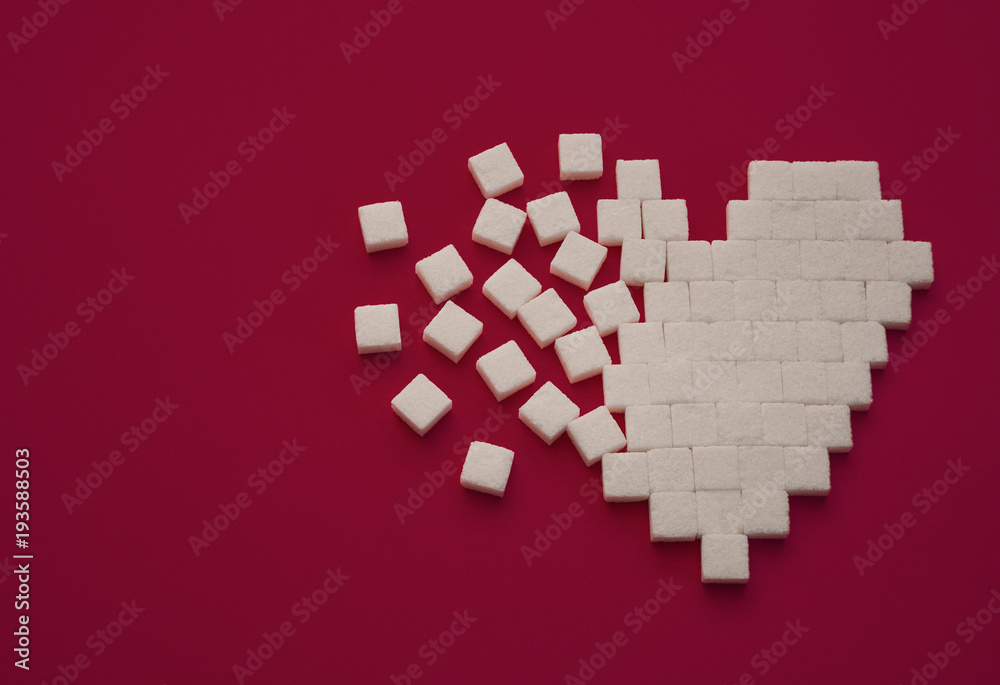 Broken heart made of sugar cubes. Rupture of relations. Sugar kills ...