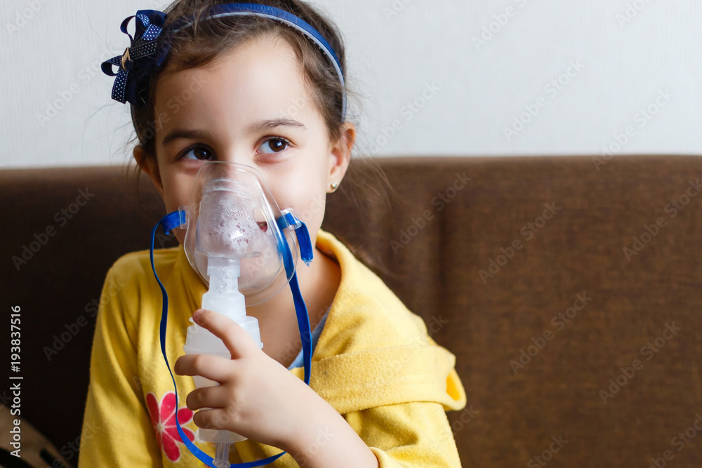 Little girl making inhalation with nebulizer at home child asthma ...
