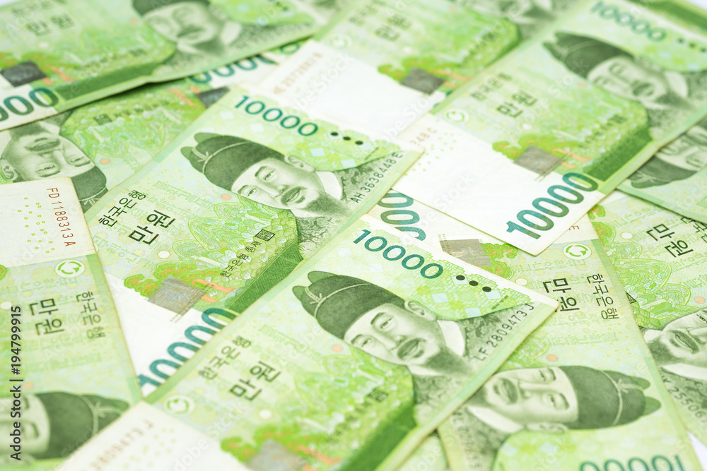 10000 Korea won bills on table as money background. South Korean ...
