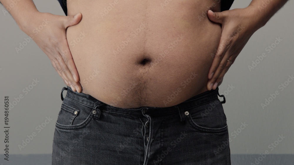 Photo Stock overweight man closeup of belly front view. put up shirt ...