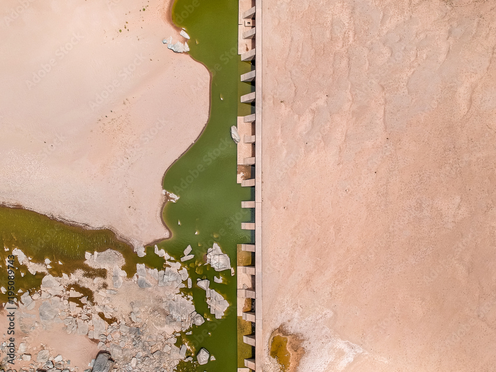 Stunning wide angle aerial drone view of the dry riverbed and an old ...