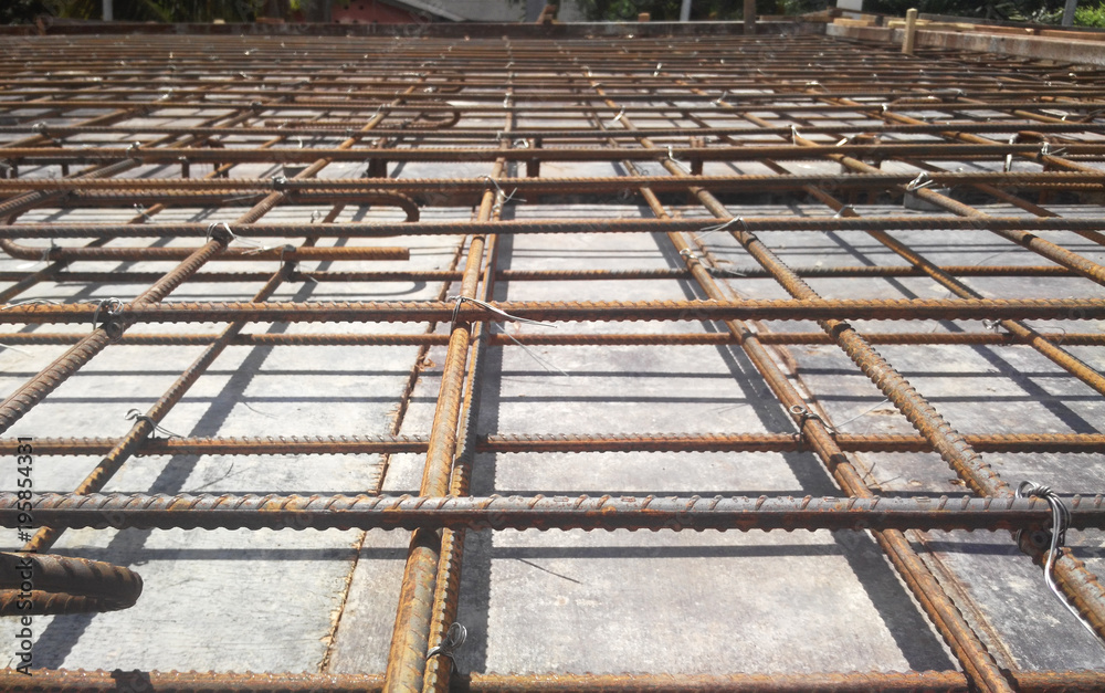 Foto de Stock Steel reinforcement bar at the construction site. It uses ...