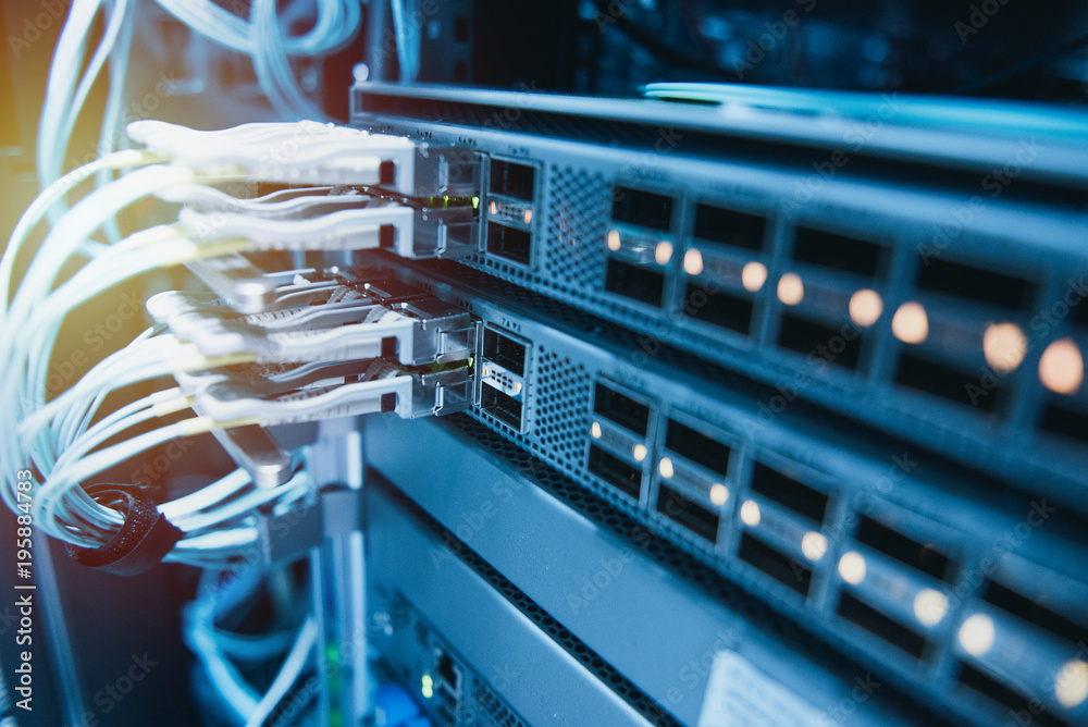 Fiber optic cables connected on core network switch . Data center ...