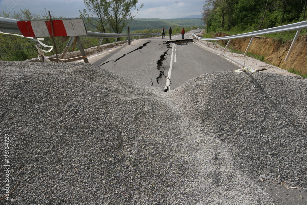 Road collapses with huge cracks. International road collapsed down ...