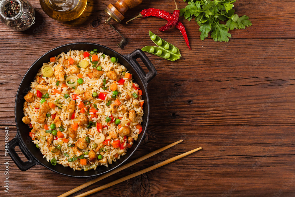 Fried rice with chicken. Prepared and served in a wok. Stock Photo ...