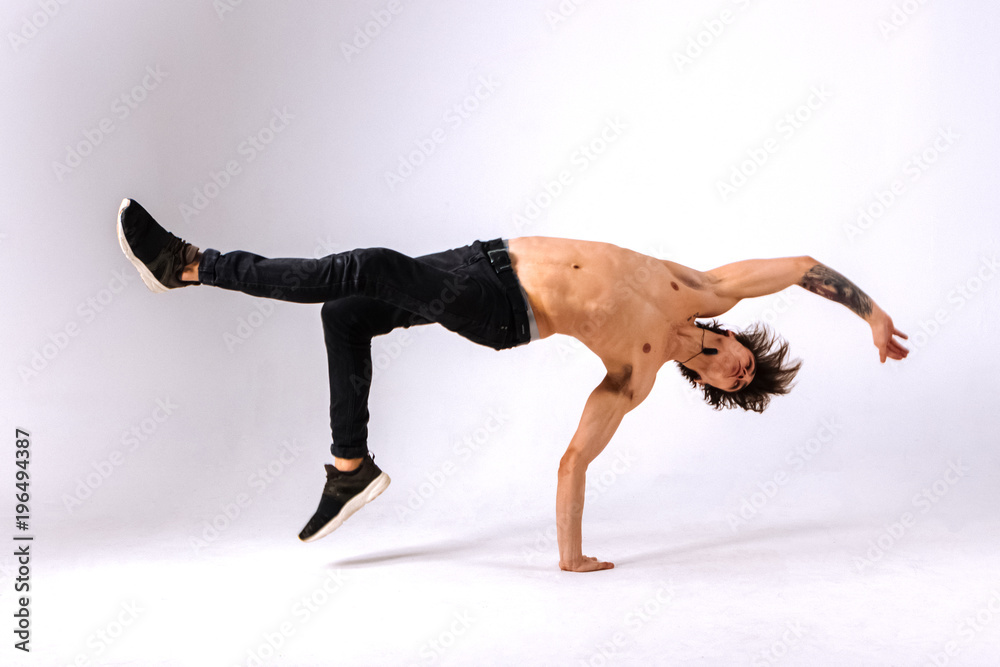 Strong powerful boy, man - freerunner, acrobat, tricker with muscular ...