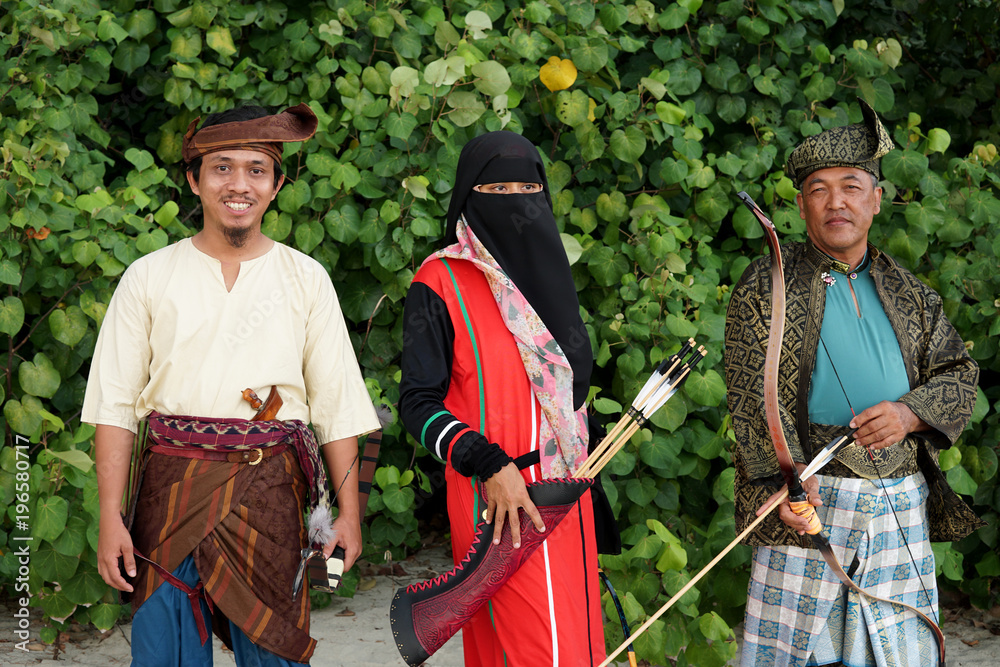 Southeast Muslim male and female archers complete with their ...
