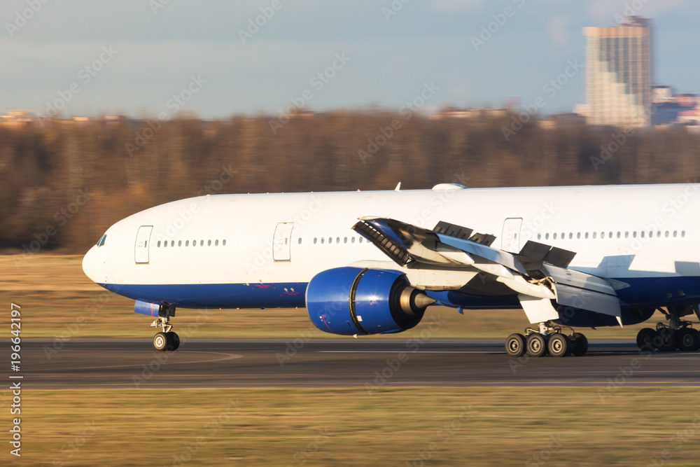 Reverse of aircraft engines during landing. Engine with active thrust ...