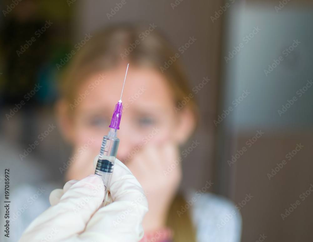 Fear of injections, the child with the nurse.The girl in the treatment ...