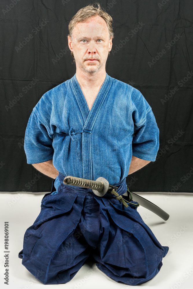 Photo Stock Caucasian male training Iaido, japanese sword sport. Hands ...