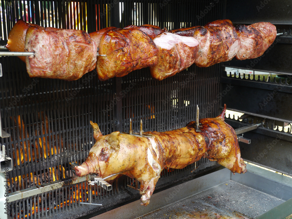 Ham and Pig Roasting over a Fire Stock Photo | Adobe Stock