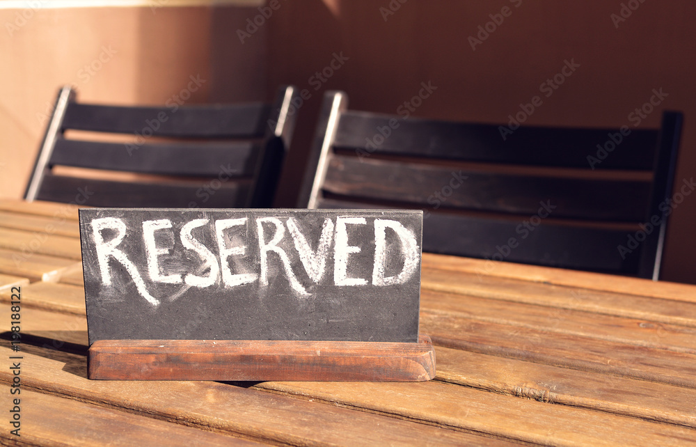 Reserved table. The reserved logo. Booking badge. Wooden reservation ...