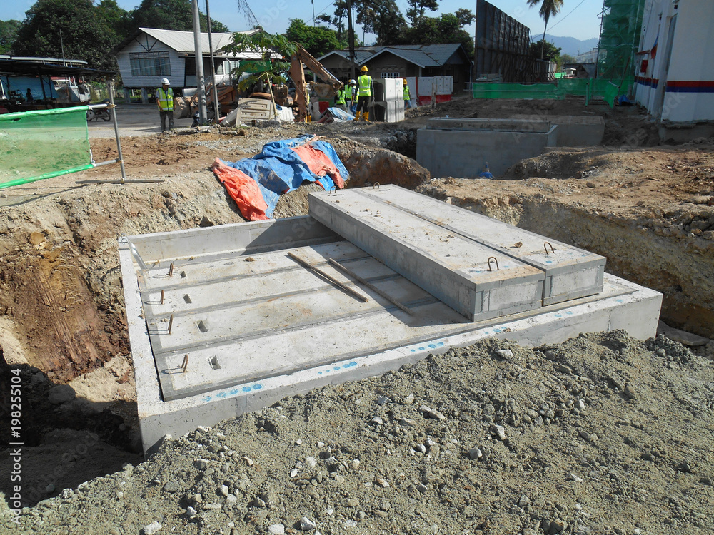 Precast concrete manhole for underground utility services under ...