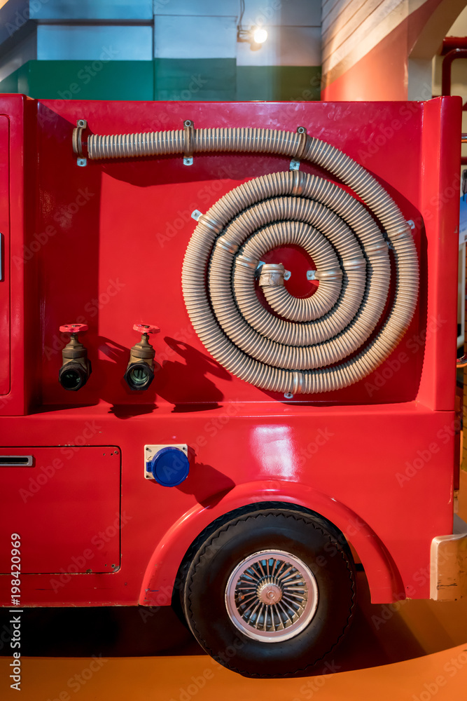 Role of fire hose on fire truck. Firefighters car Stock Photo | Adobe Stock