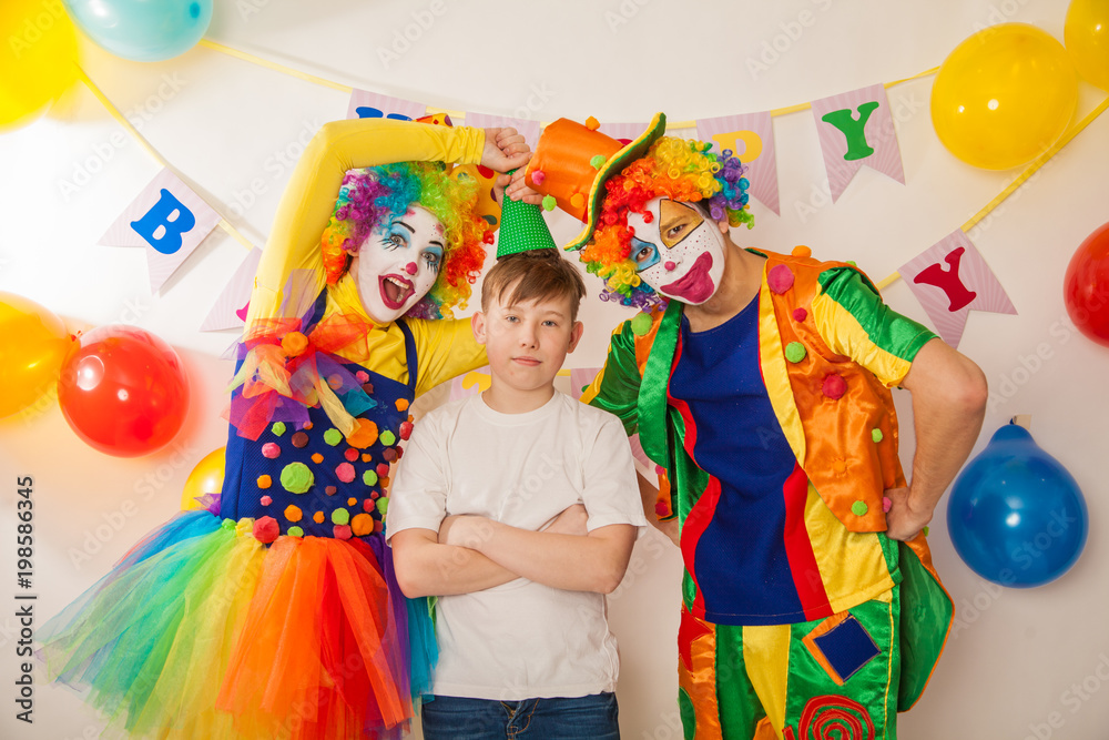clown girl and clown boy at the birthday of a child. Party for children ...
