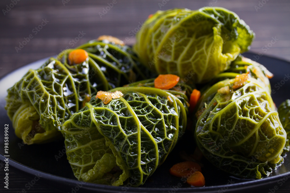 Stuffed cabbage leaves. Cabbage rolls. Savoy cabbage leaves wrapped ...