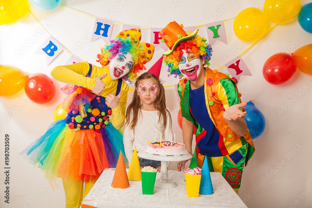 clown girl and clown boy at the children's birthday party. Festive ...