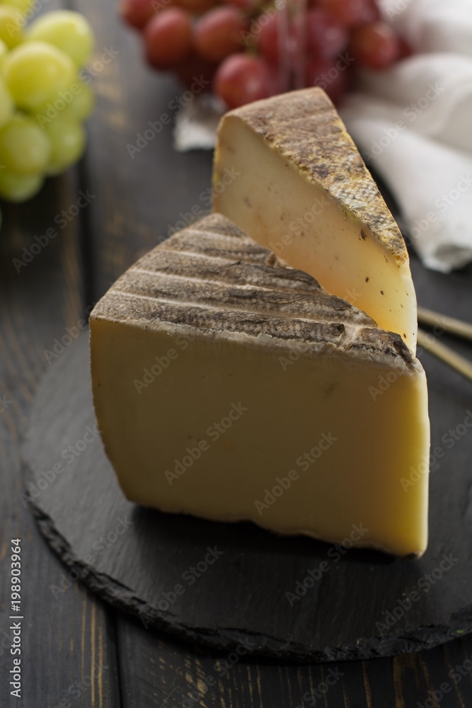 Tasting of ancient french demi soft cheese Tomme from French Alps, made ...