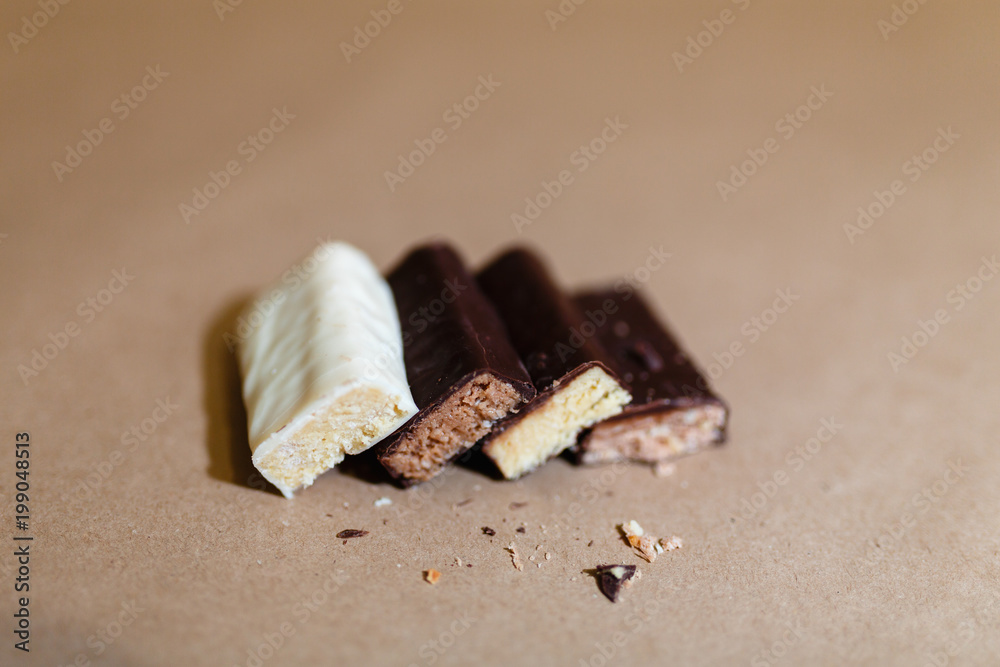 Four chocolate protein bars with different flavors in the context of ...