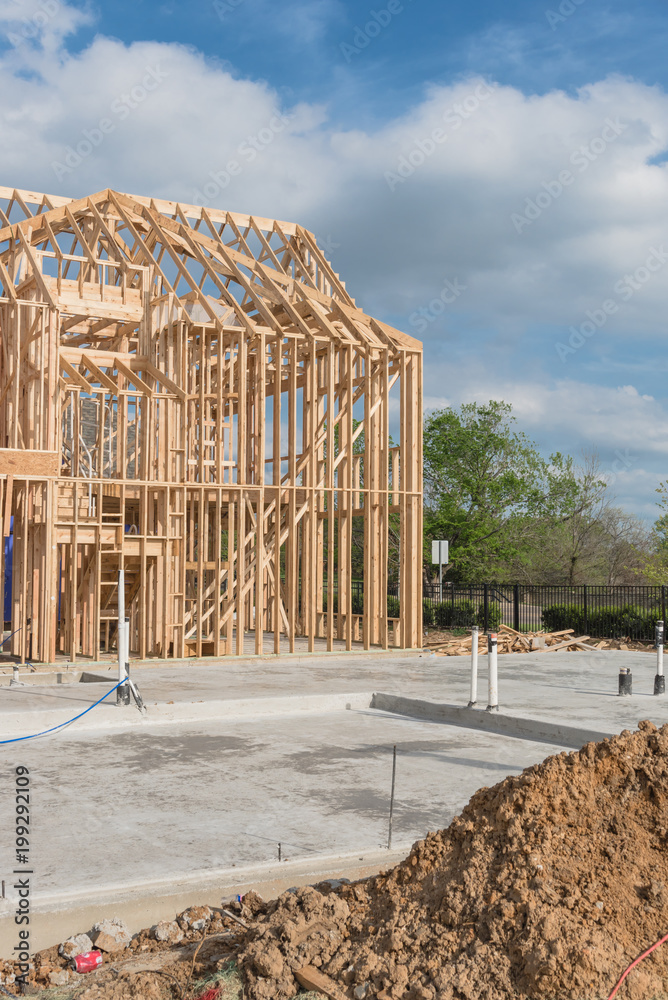 Slab-on-grade foundation footing timber frame house under construction ...