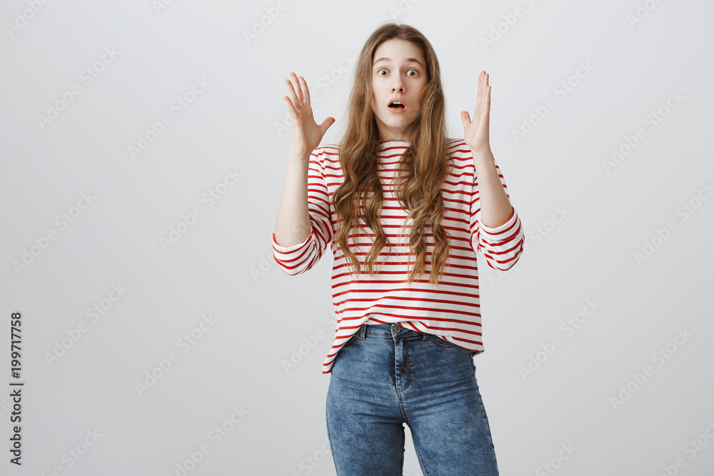 Girl heard unbelievable news. Studio shot of caucasian female student ...