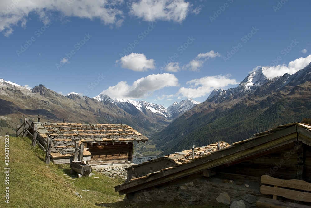 Foto de Stock Valais snow covered mountains, small wooden hut, glacier ...