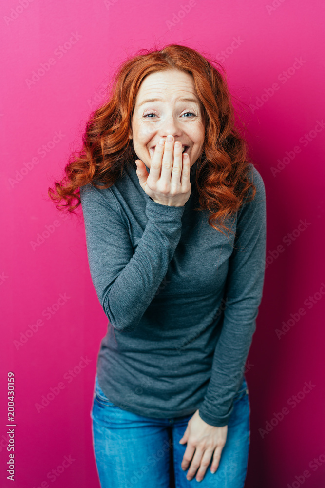 Young red-haired laughing woman on pink background Stock Photo | Adobe ...