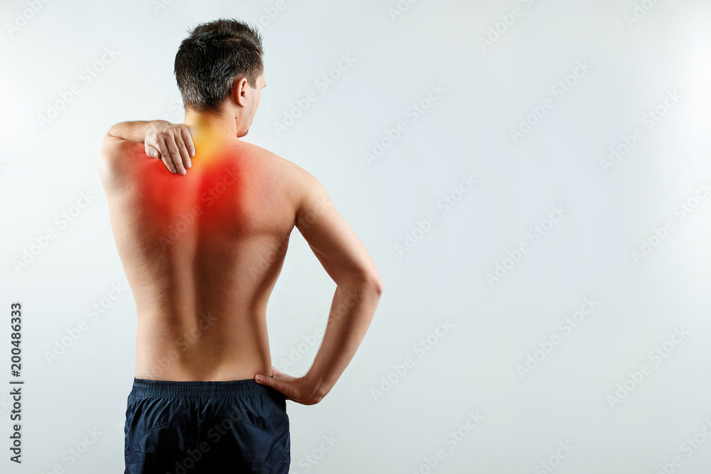 A man holds his hands for a damaged shoulder, a pain in his shoulder ...