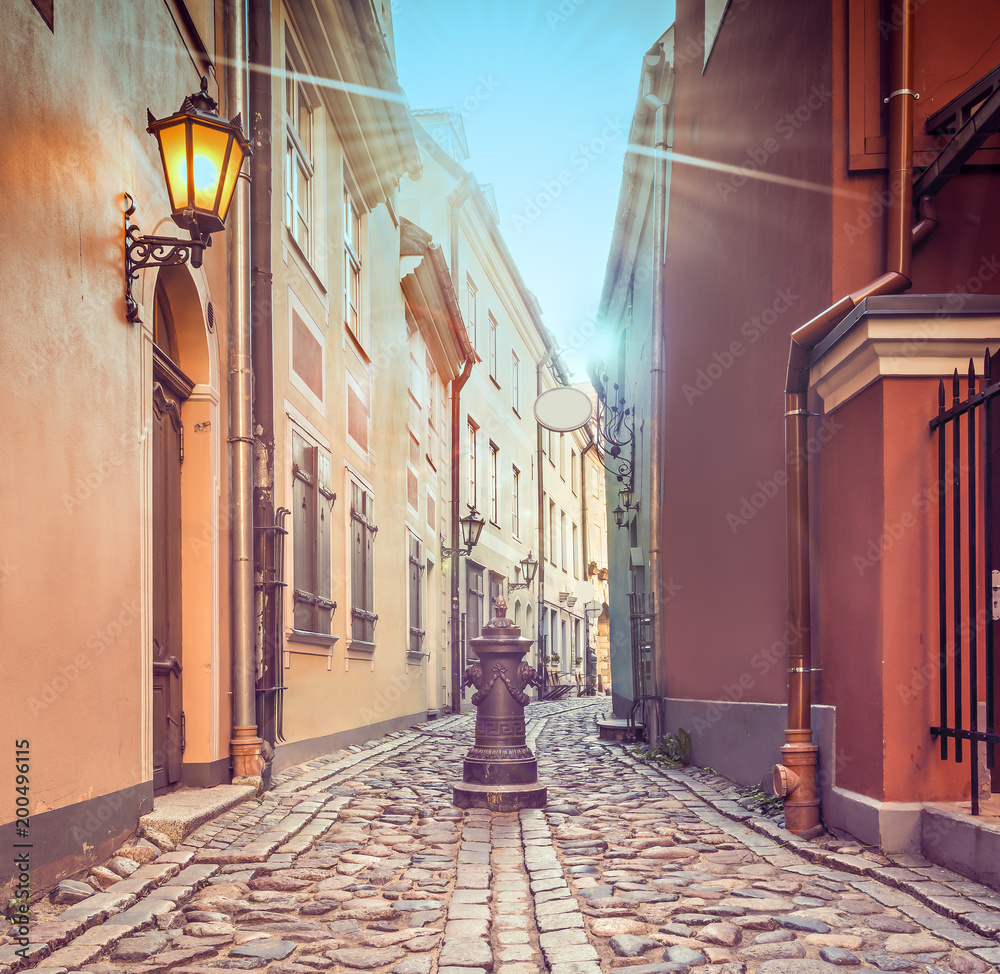 Fantasy image with narrow medieval street in medieval part of Riga city ...